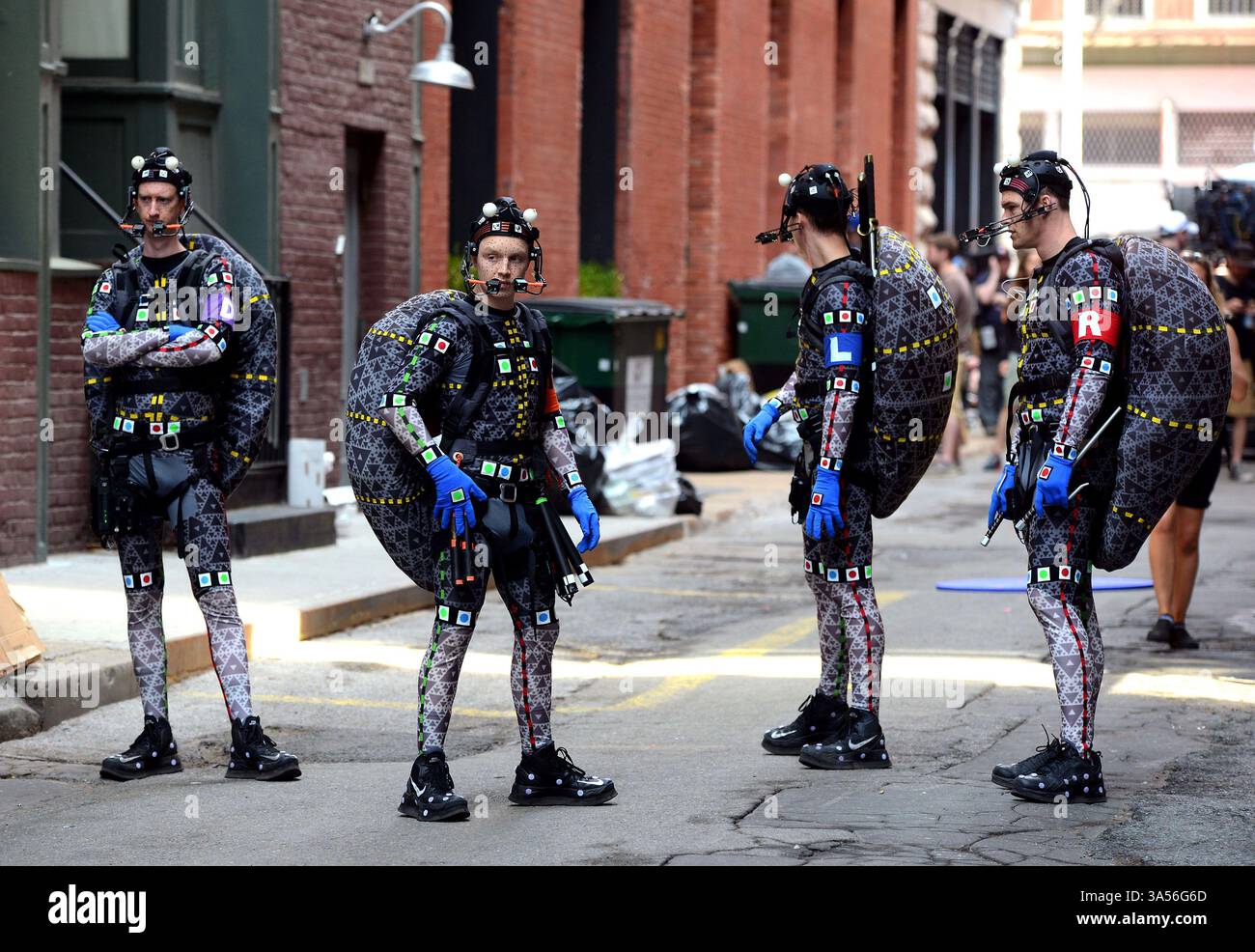 Actors in turtle suits on the downtown Manhattan set of the movie ...