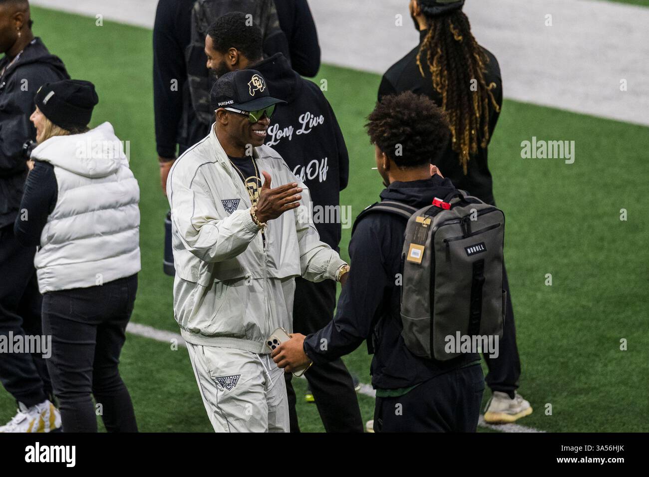 Colorado State's head coach Deion Sanders visits wtih players during ...