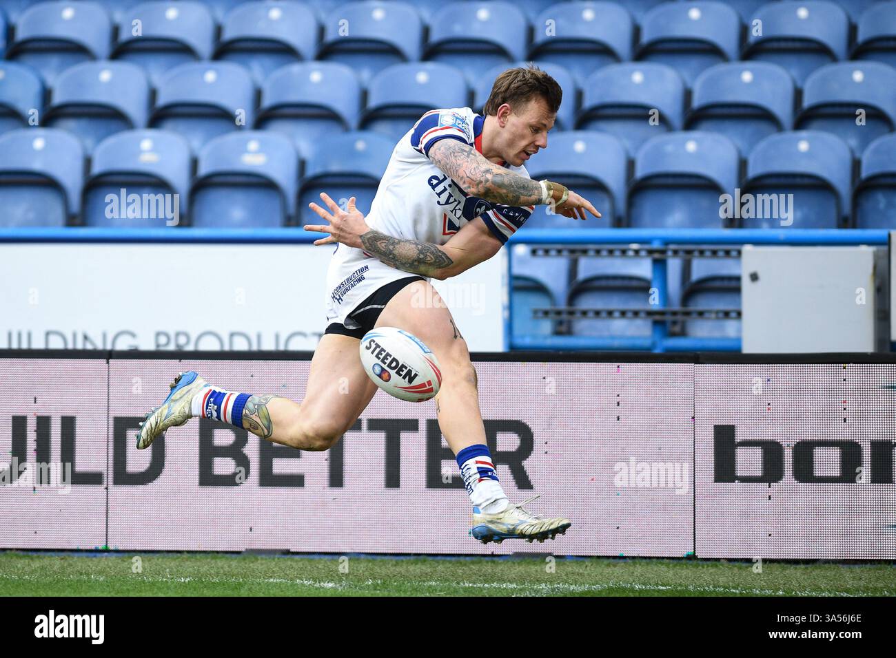 Huddersfield, England - 16th March 2025 - Wakefield Trinity's Tom Johnstone forces the ball in ...