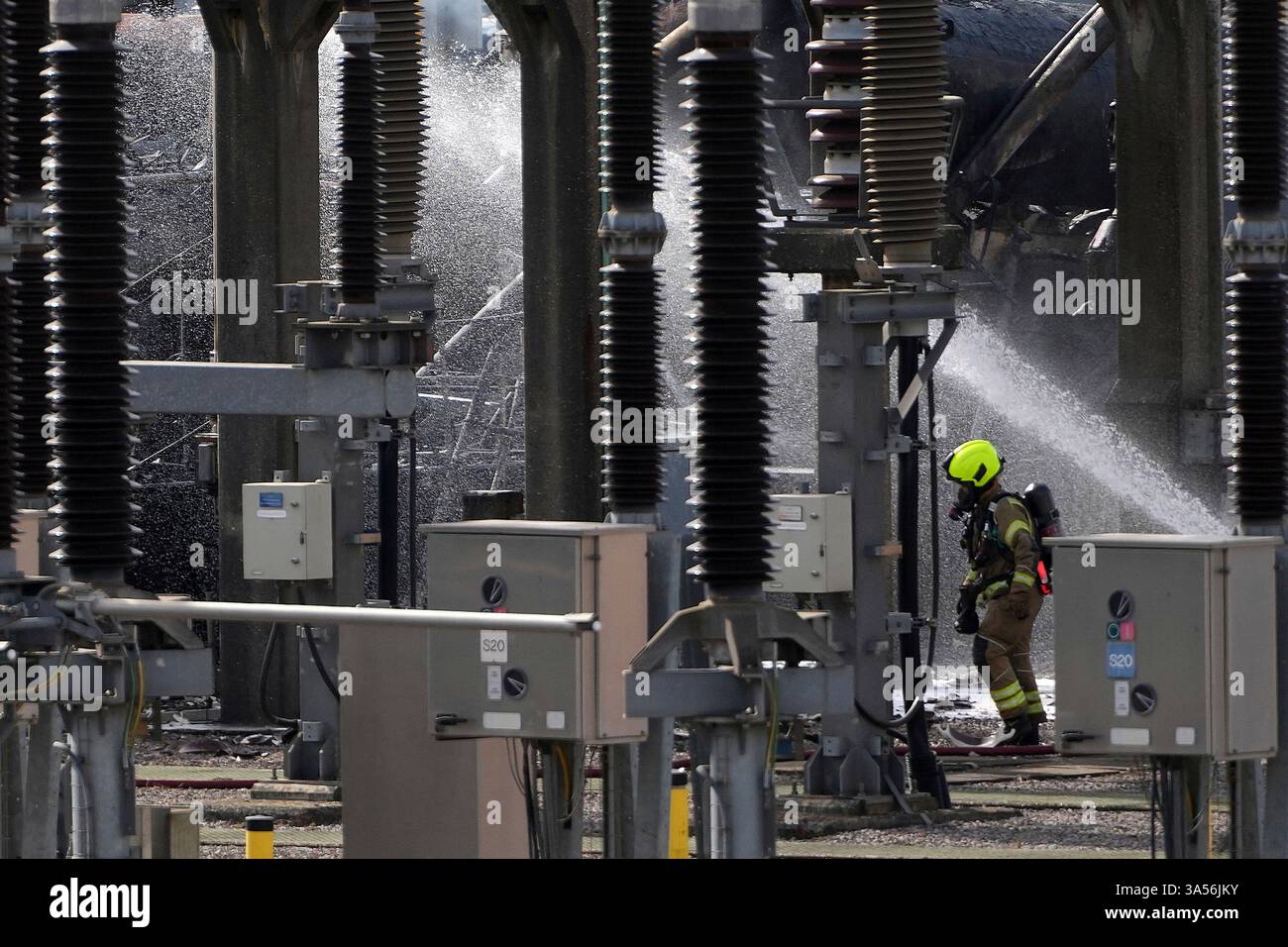 A fireman works at the North Hyde electrical substation, which caught ...