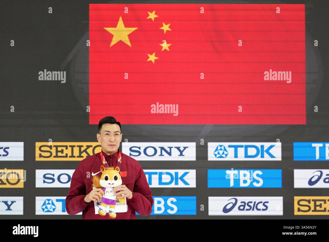 Silver medalist Yaming Zhu, of China, poses on the podium of the men's ...