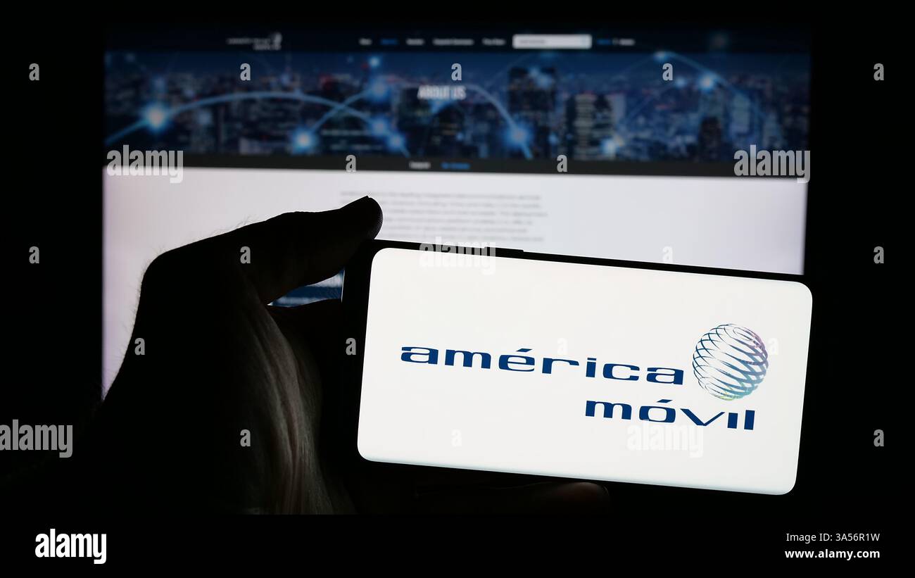 Stuttgart, Germany - 11-08-2024: Person holding mobile phone with logo ...