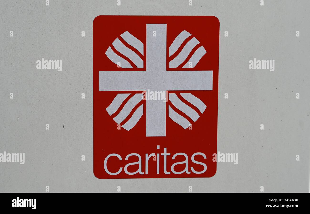 Munich, Germany. 21st Mar, 2025. A sign with the Caritas logo Credit ...