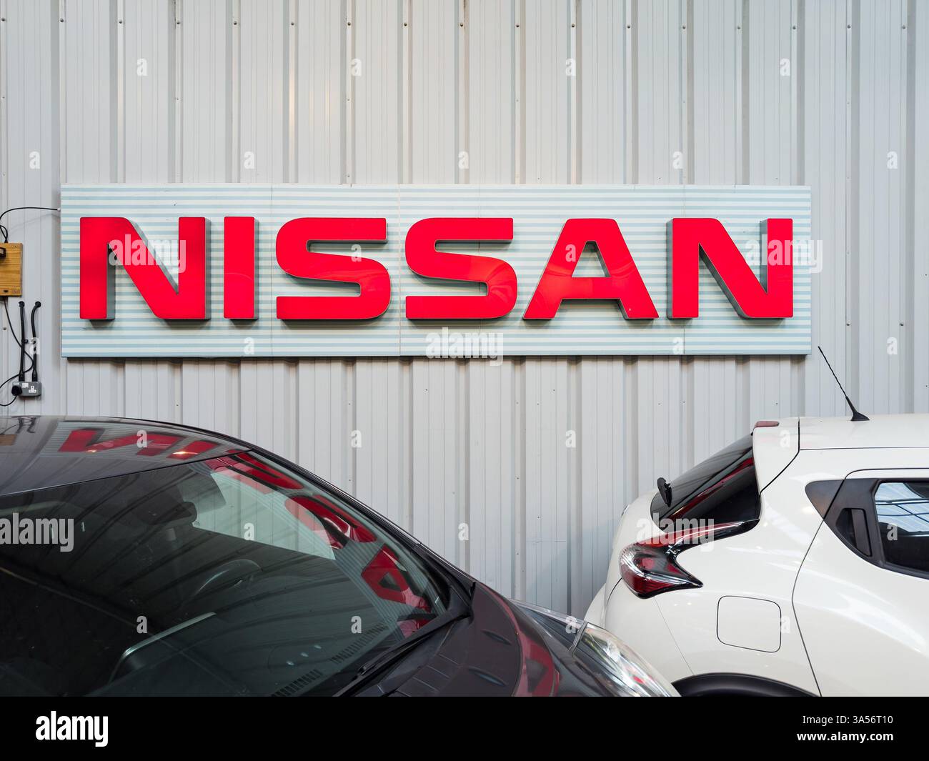 NISSAN logo sign on corrugated metal wall at NELSAM north east land sea ...