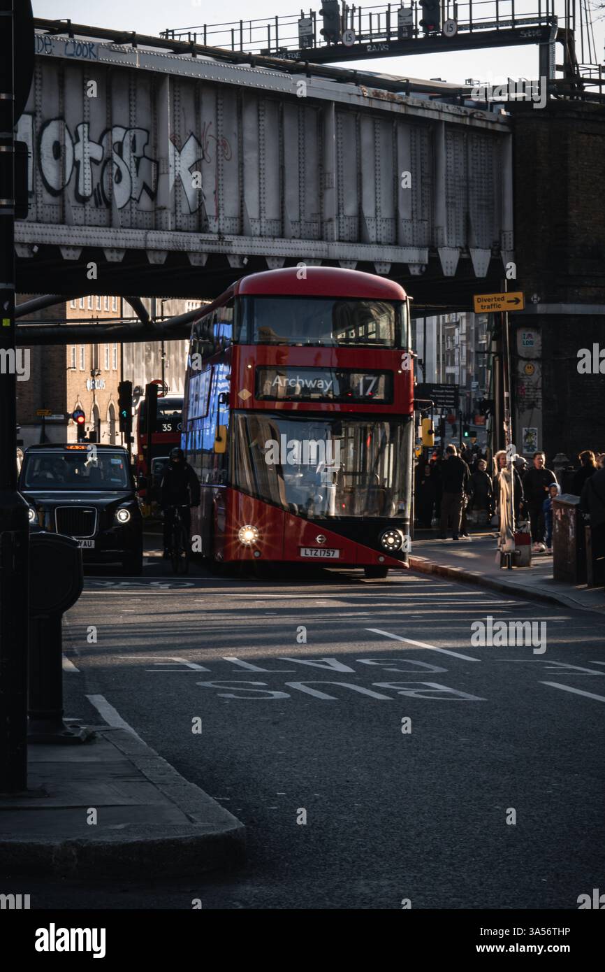 Look around, you might see more than just a girl, a bus, a busy street ...