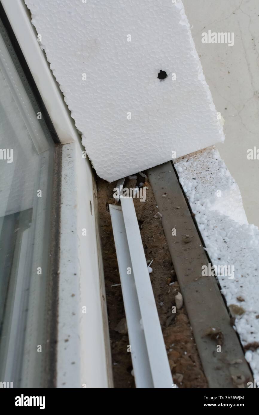 Insulation of the facade around the window. Insulation of the facade ...