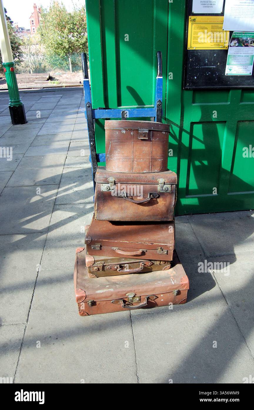 a stack of vintage luggage on railway porter's hand cart on Quorn ...