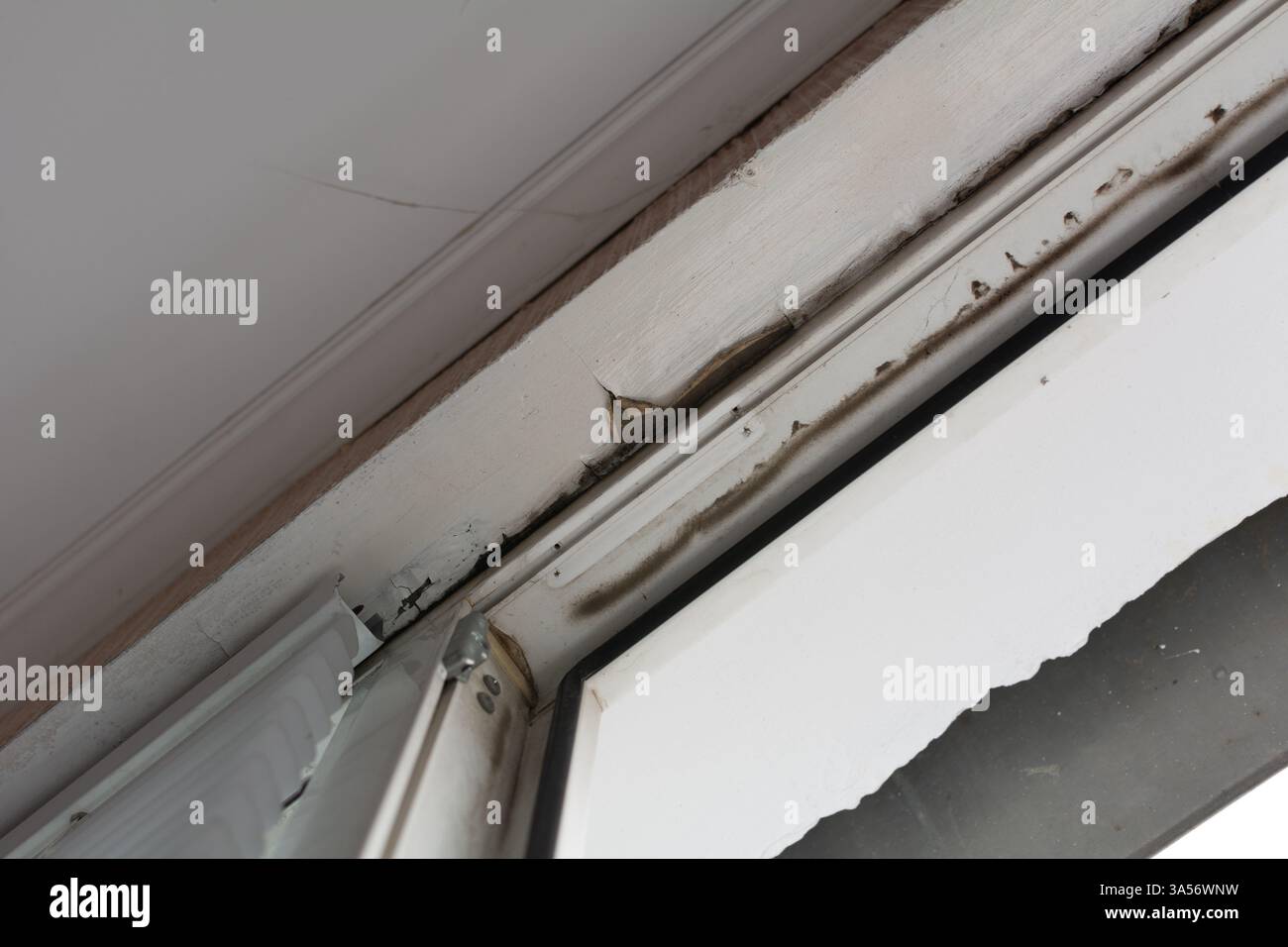 Rain drips between the window frame and the ceiling. Roof damage due to ...