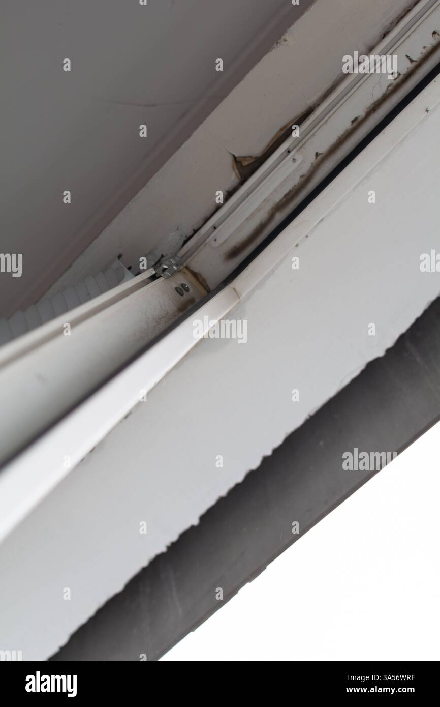 Rain drips between the window frame and the ceiling. Roof damage due to ...