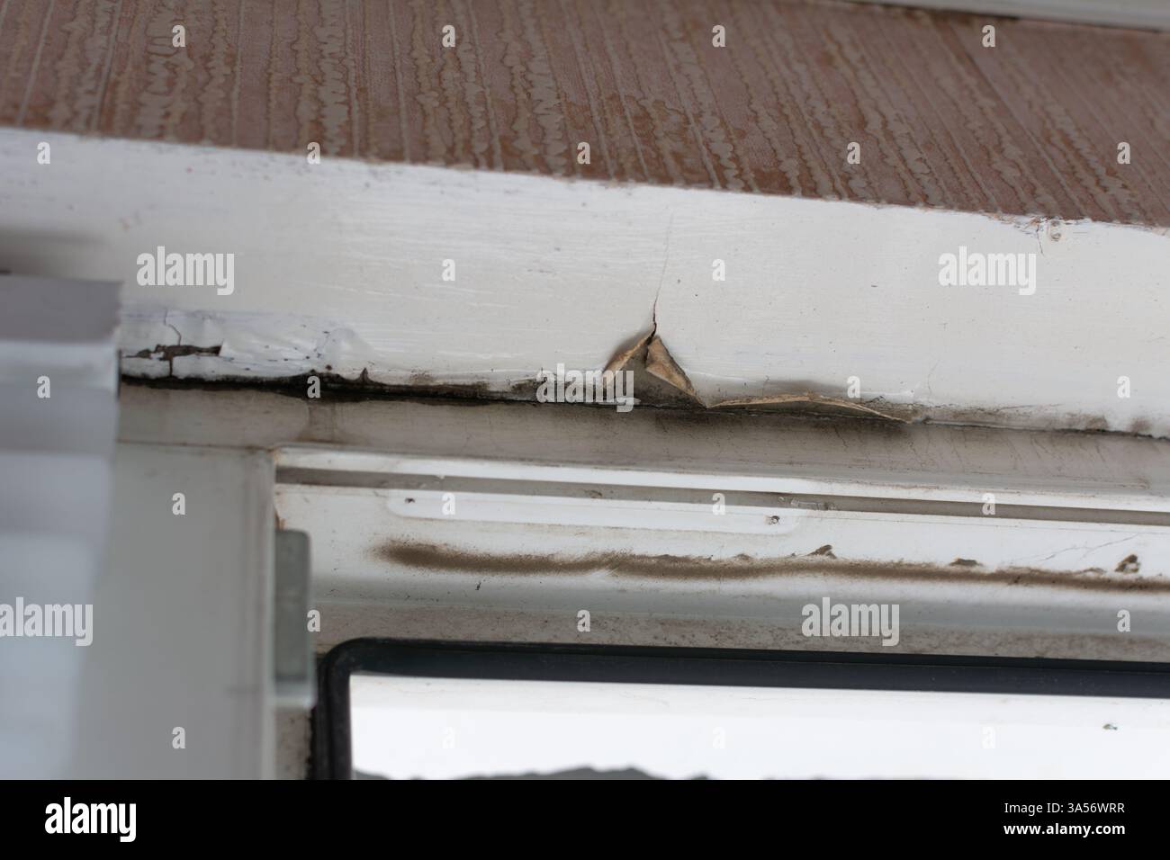 Rain drips between the window frame and the ceiling. Roof damage due to ...