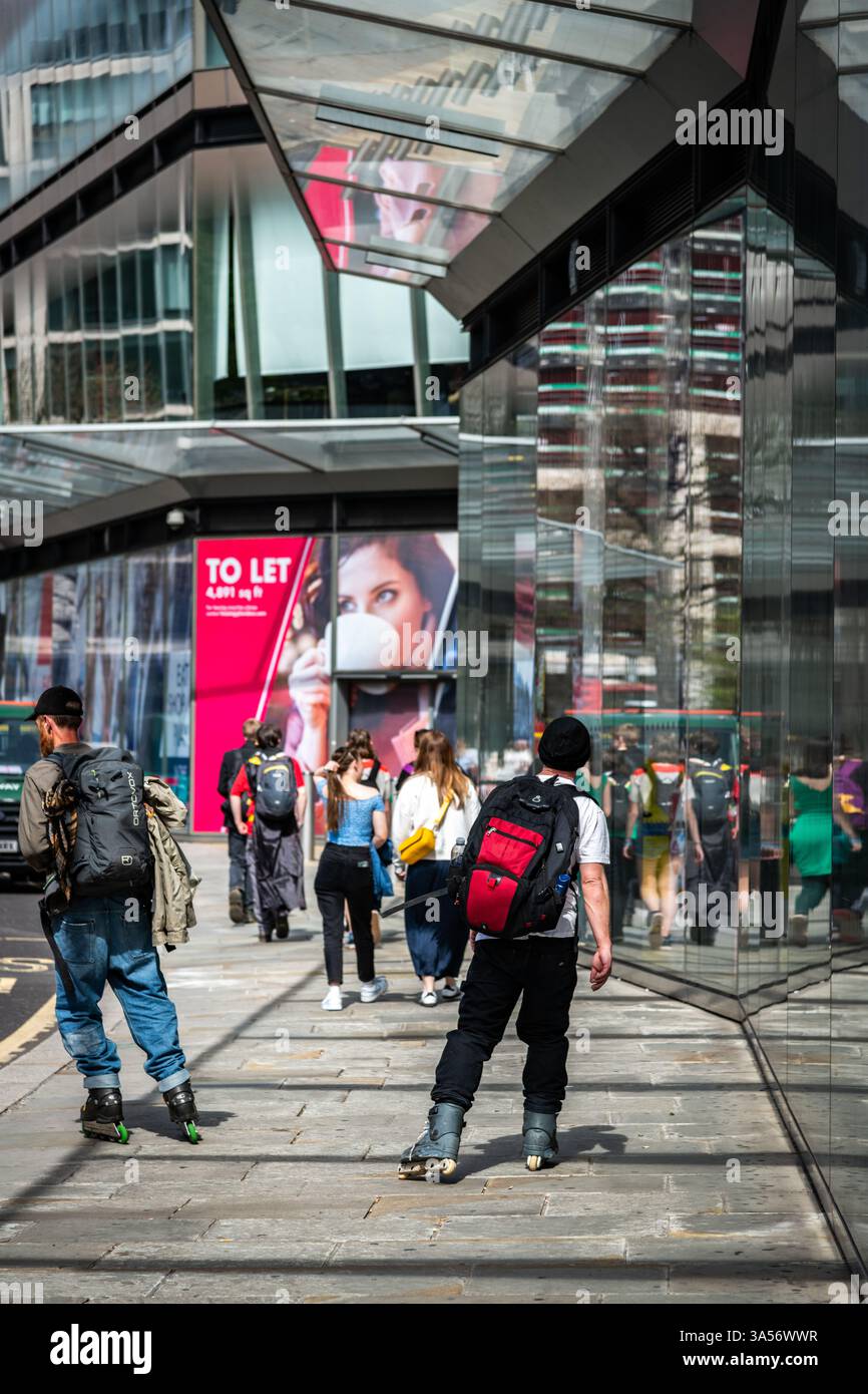 two guys rollerblading in central London Stock Photo - Alamy
