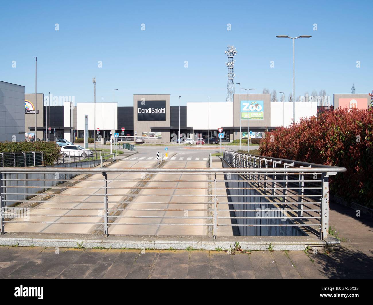 Concrete access ramp leading to Scalo Milano shopping center with Dondi ...
