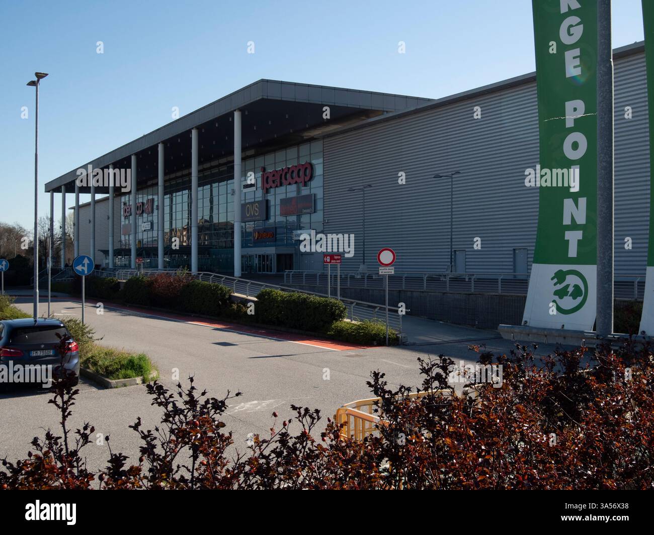 Modern shopping mall with charge point signage for electric vehicles ...