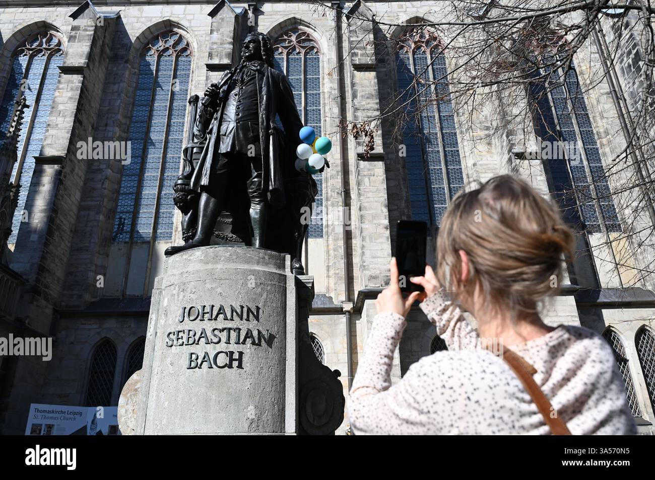 Leipzig, Germany. 21st Mar, 2025. A person takes a photo of the Johann ...