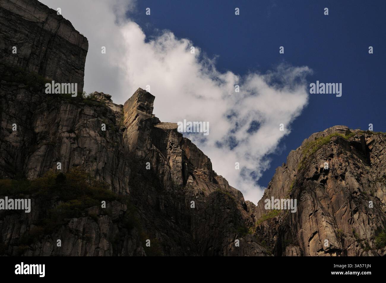 Pulpit Rock (Preikestolen),a popular tourist attraction seen from below ...