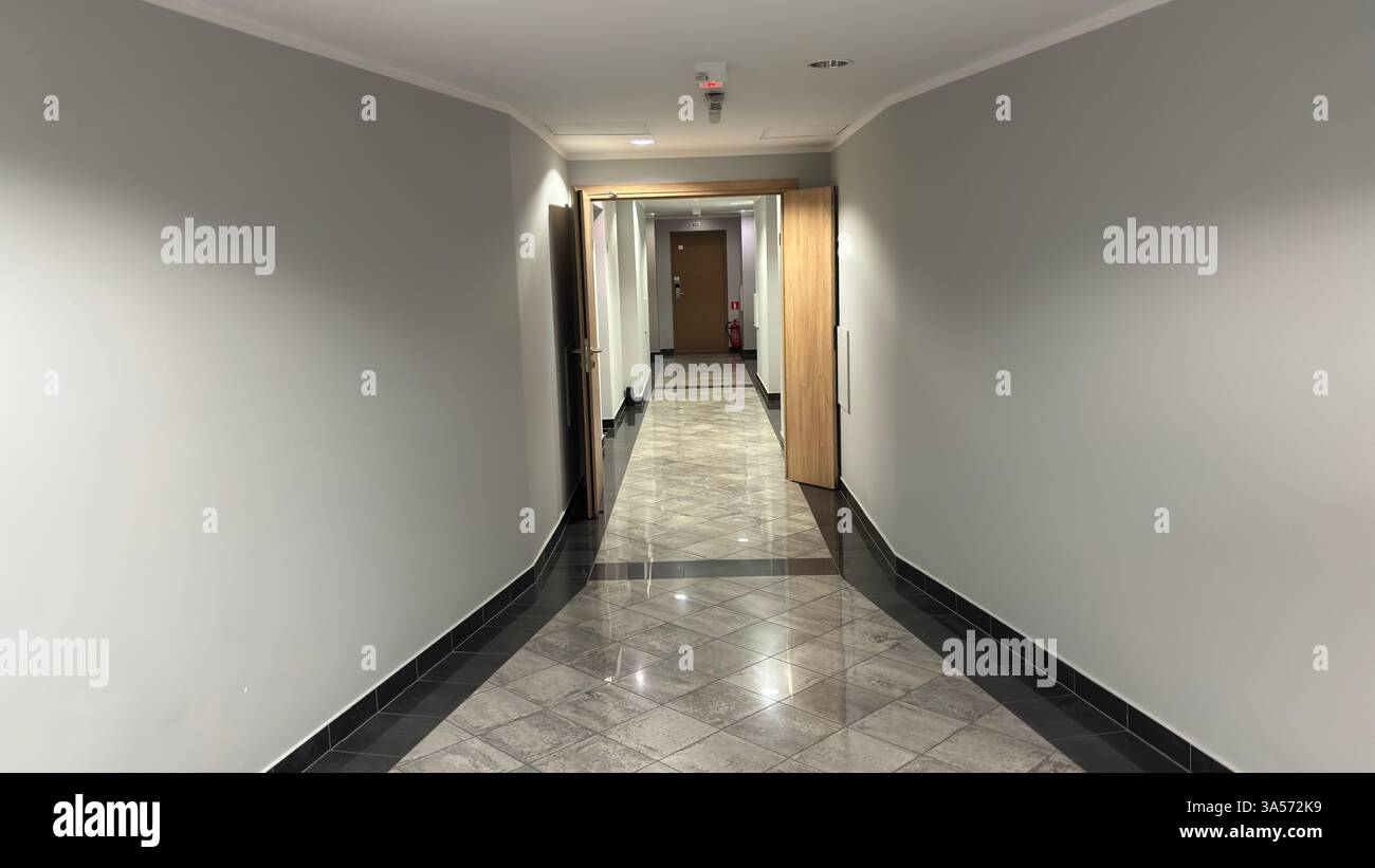 interior of a hotel. Tiled corridor inside a hotel. corridor in a ...