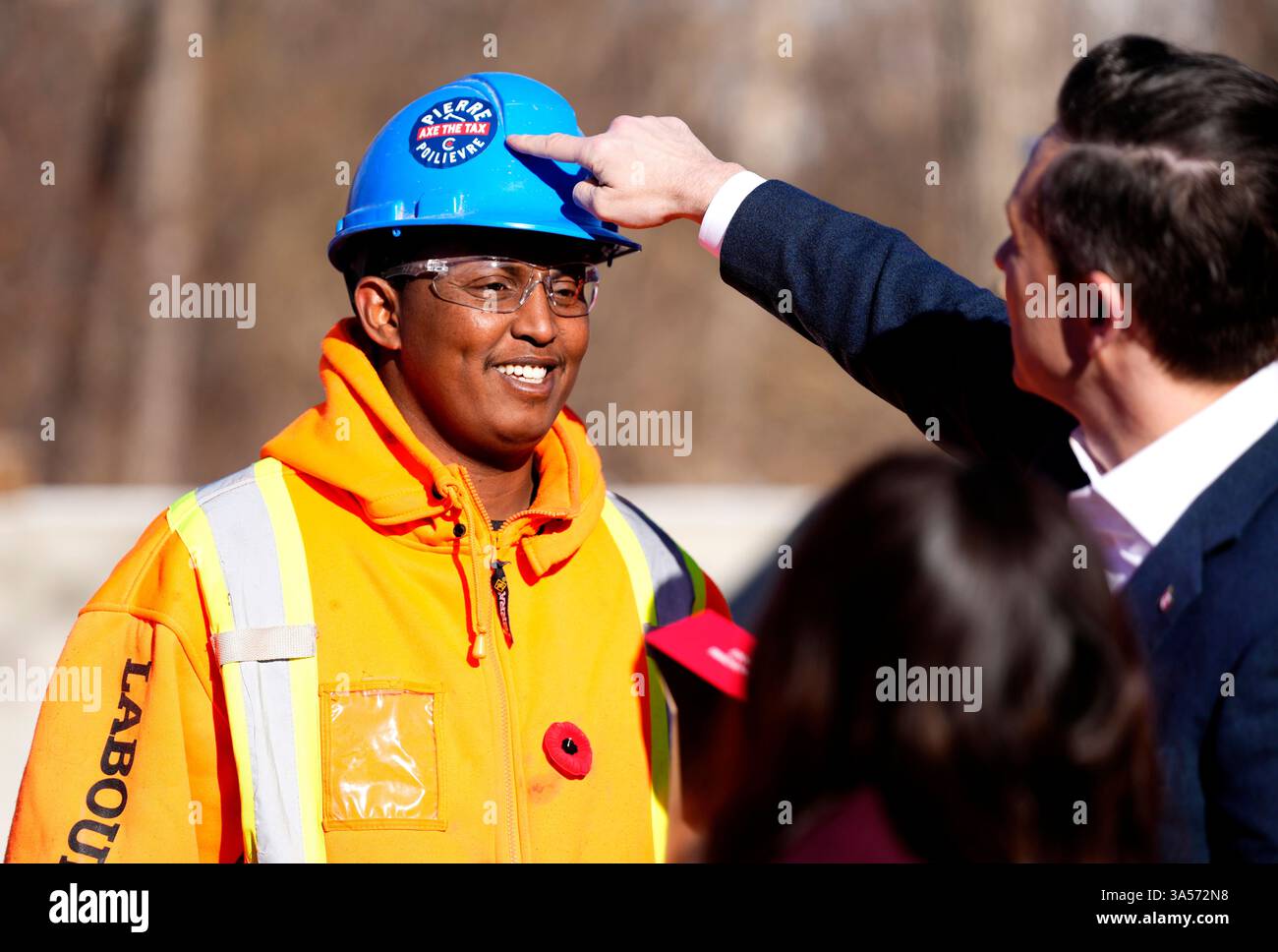 Conservative Leader Pierre Poilievre points at the sticker on a LiUNA ...
