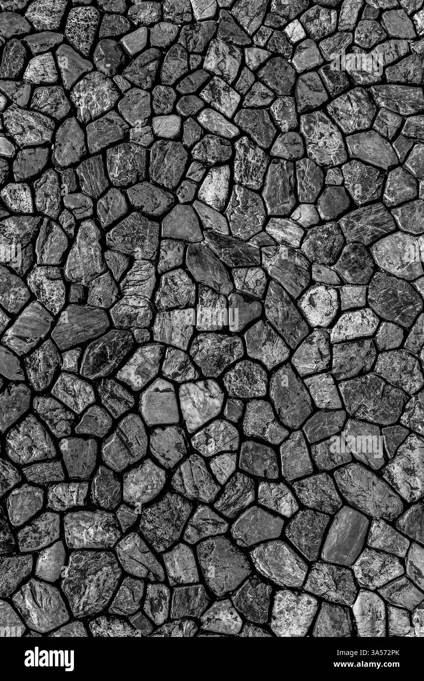 Monochrome textured stone background featuring irregularly shaped rocks ...
