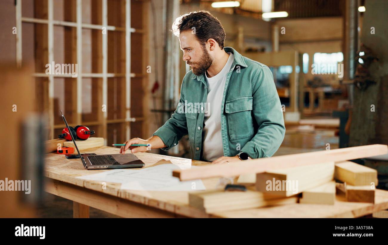 Carpenter, laptop and plans with wood to measure for construction ...