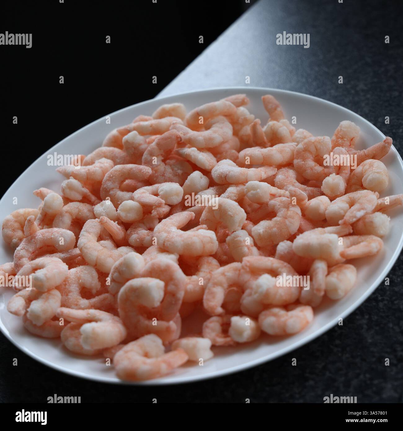 Frozen prawns in a plate Stock Photo - Alamy