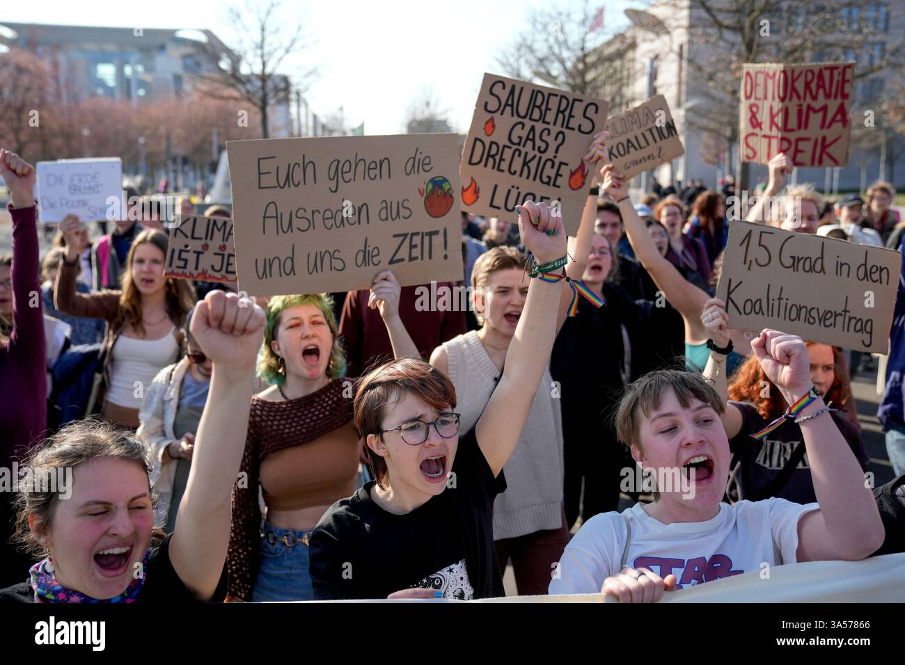 Participants chant slogans during a climate strike demonstration ...