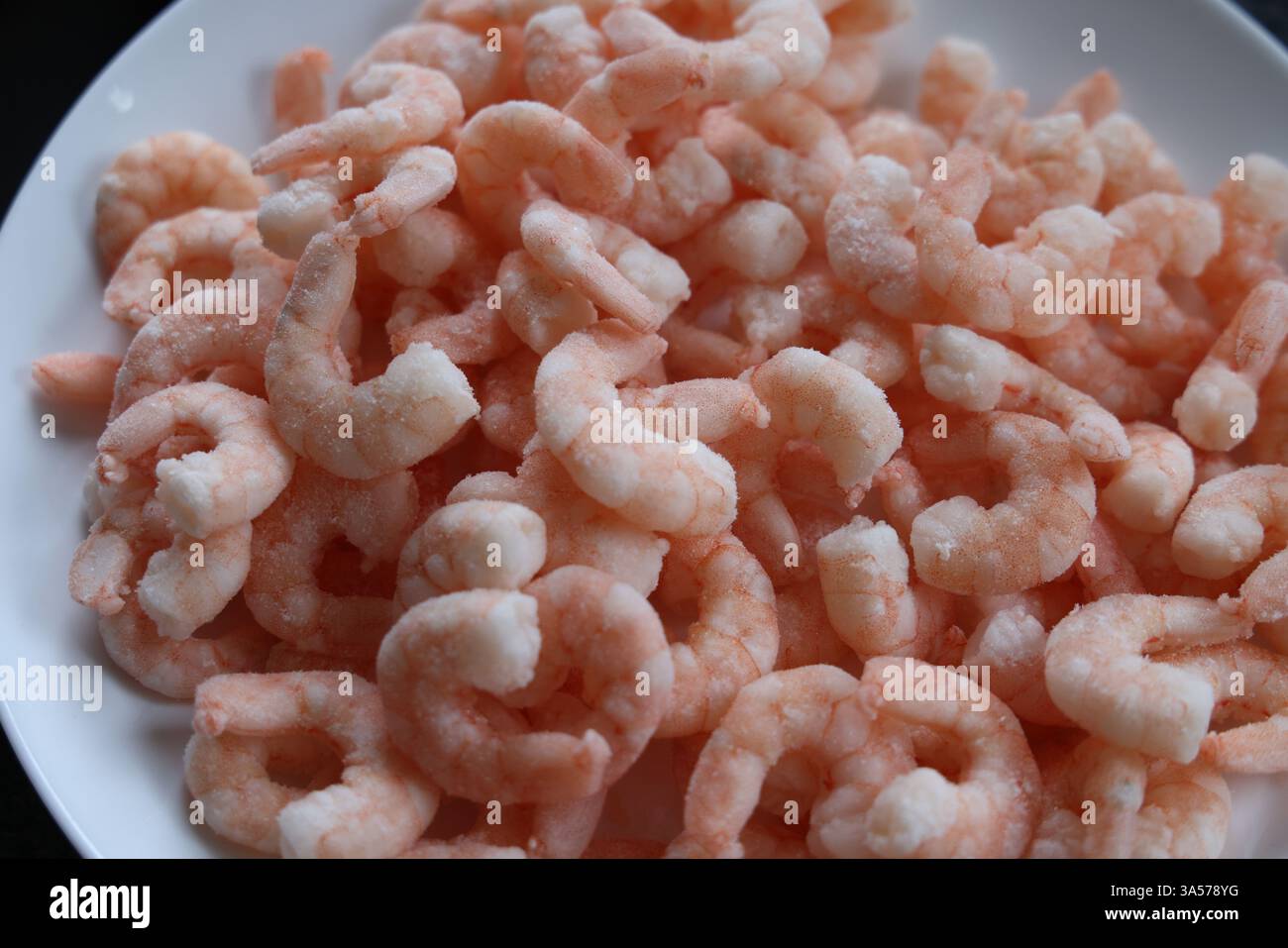 Frozen prawns in a plate Stock Photo - Alamy