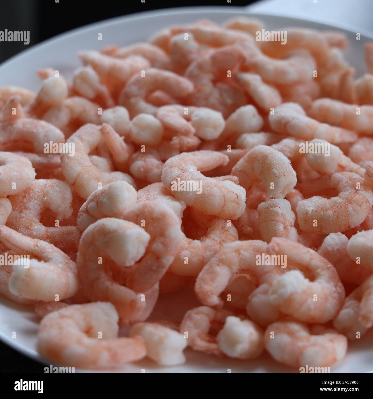 Frozen prawns in a plate Stock Photo - Alamy