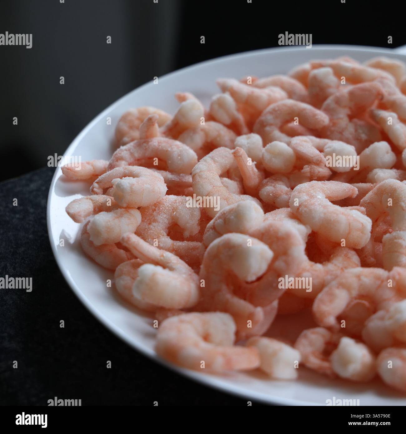 Frozen prawns in a plate Stock Photo - Alamy