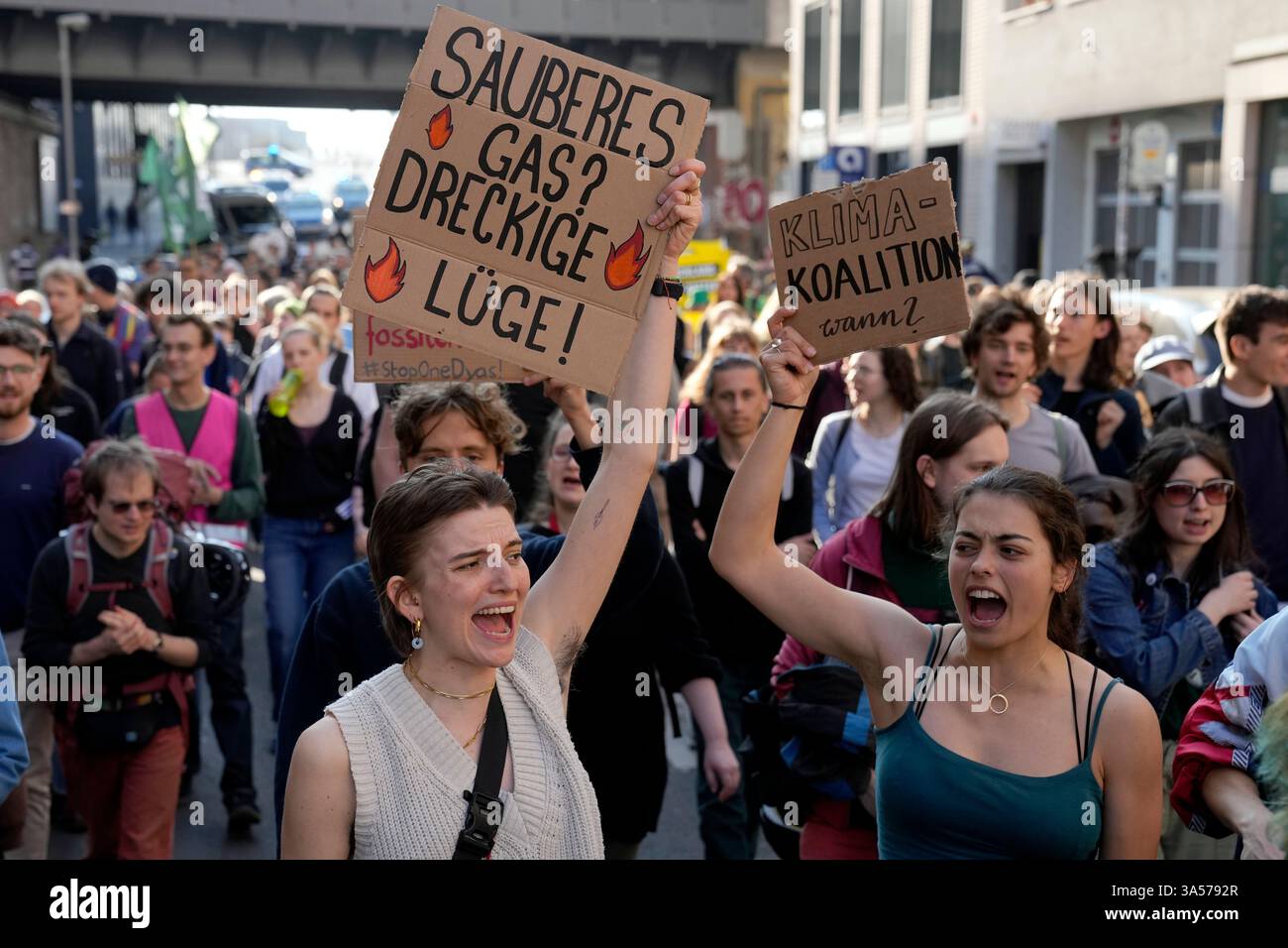 Participants chant slogans during a climate strike demonstration ...