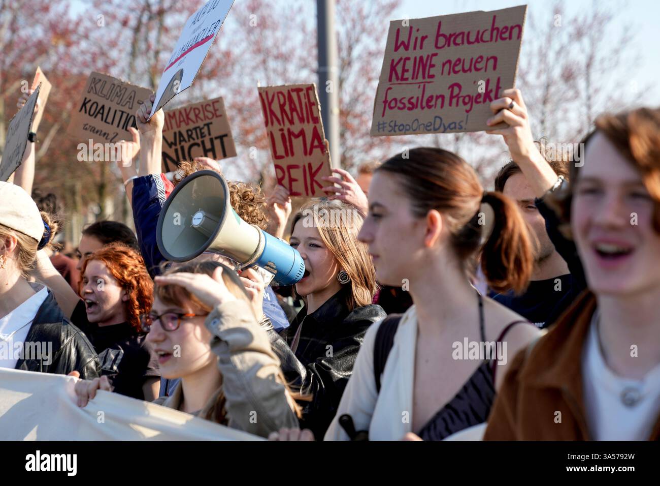Participants chant slogans during a climate strike demonstration ...
