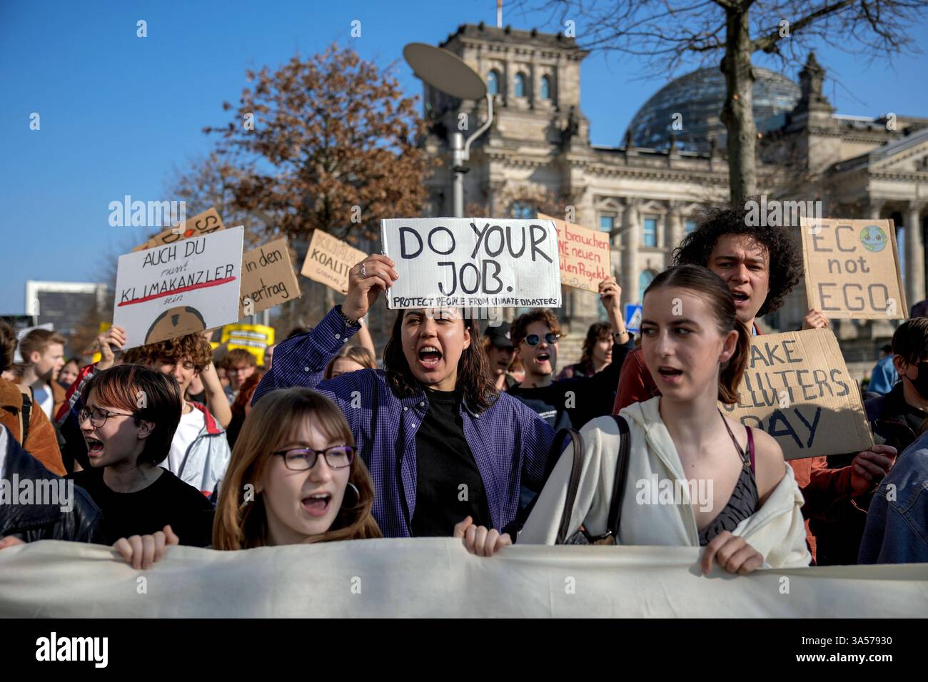 Participants chant slogans during a climate strike demonstration ...
