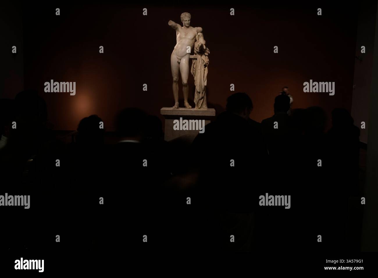 Hermes of Praxiteles, an ancient statue dating back to 340 B.C., stands ...