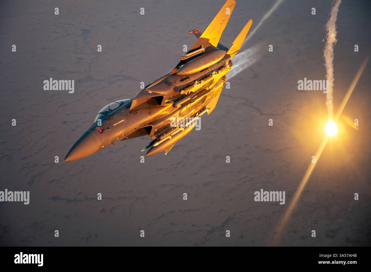 A U.S. Air Force F-15E Strike Eagle performs a flare check over the U.S ...