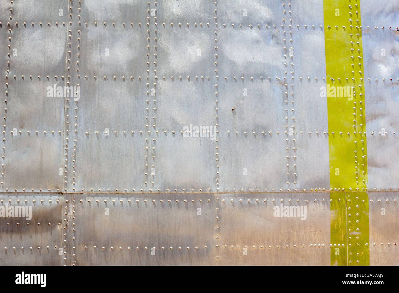 A view of the texture of aircraft metal with rivet patterns, as a ...