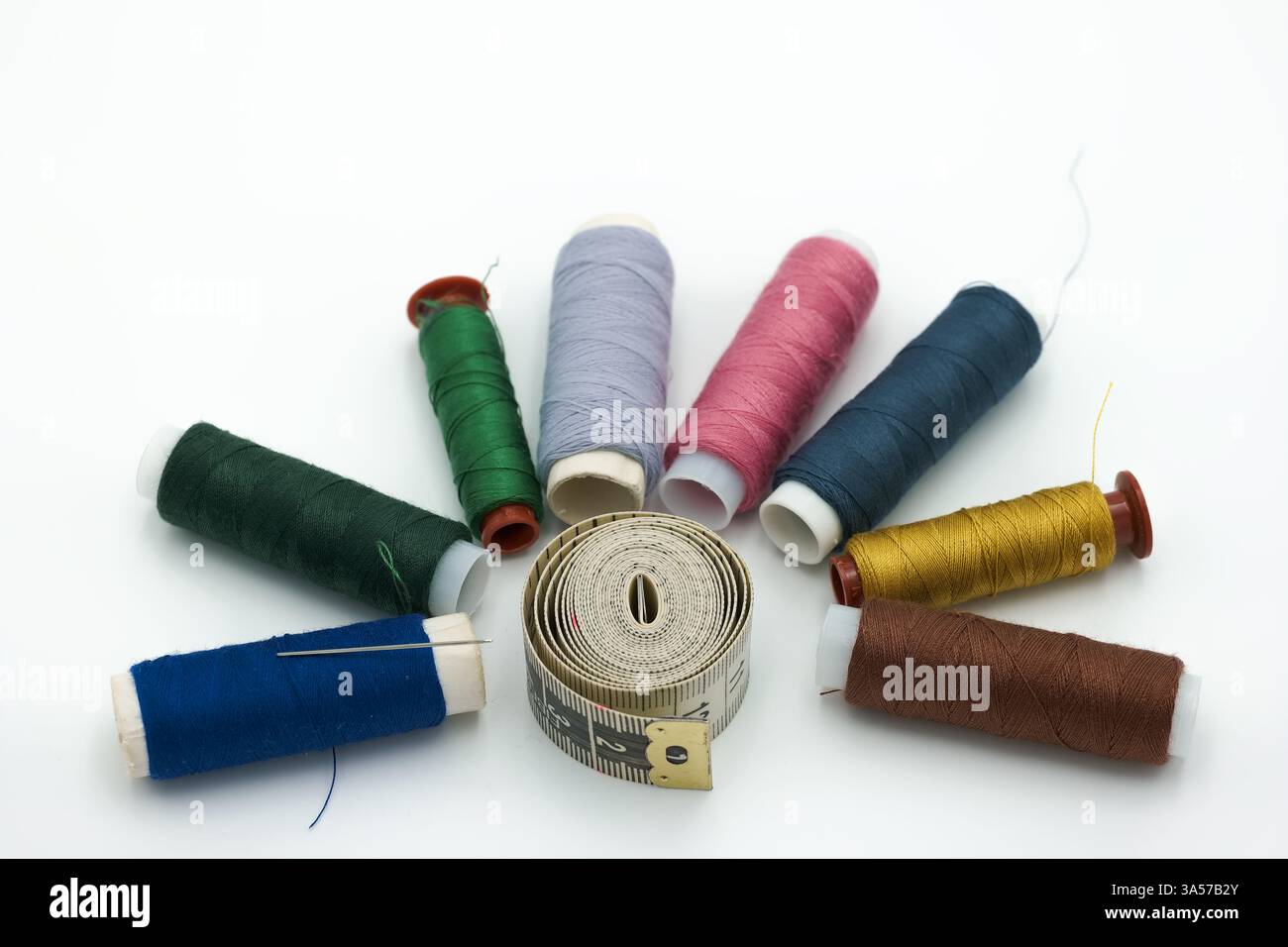 sewing threads and materials cut off on a white background Stock Photo ...