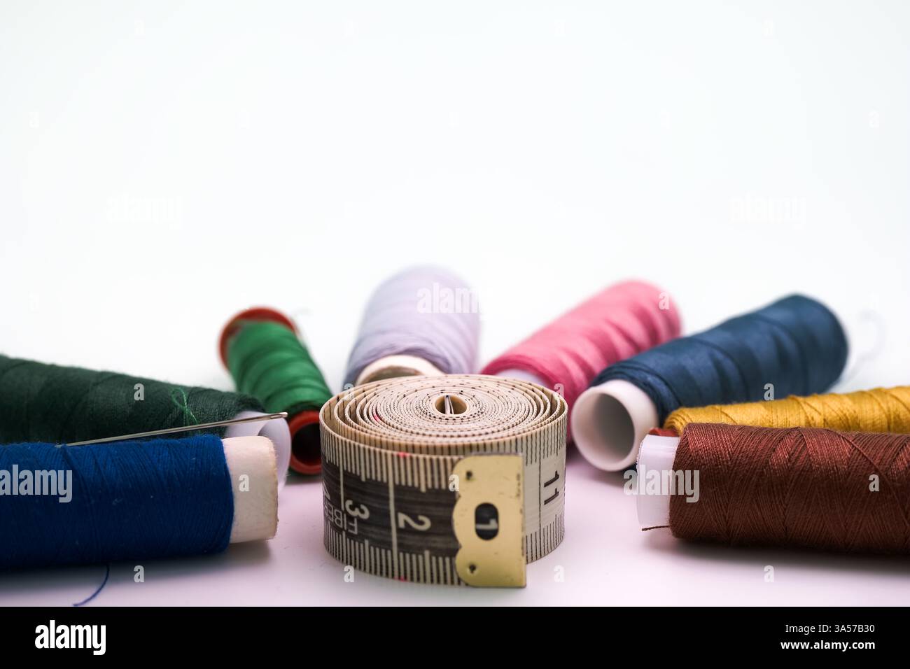 sewing threads and materials cut off on a white background Stock Photo ...