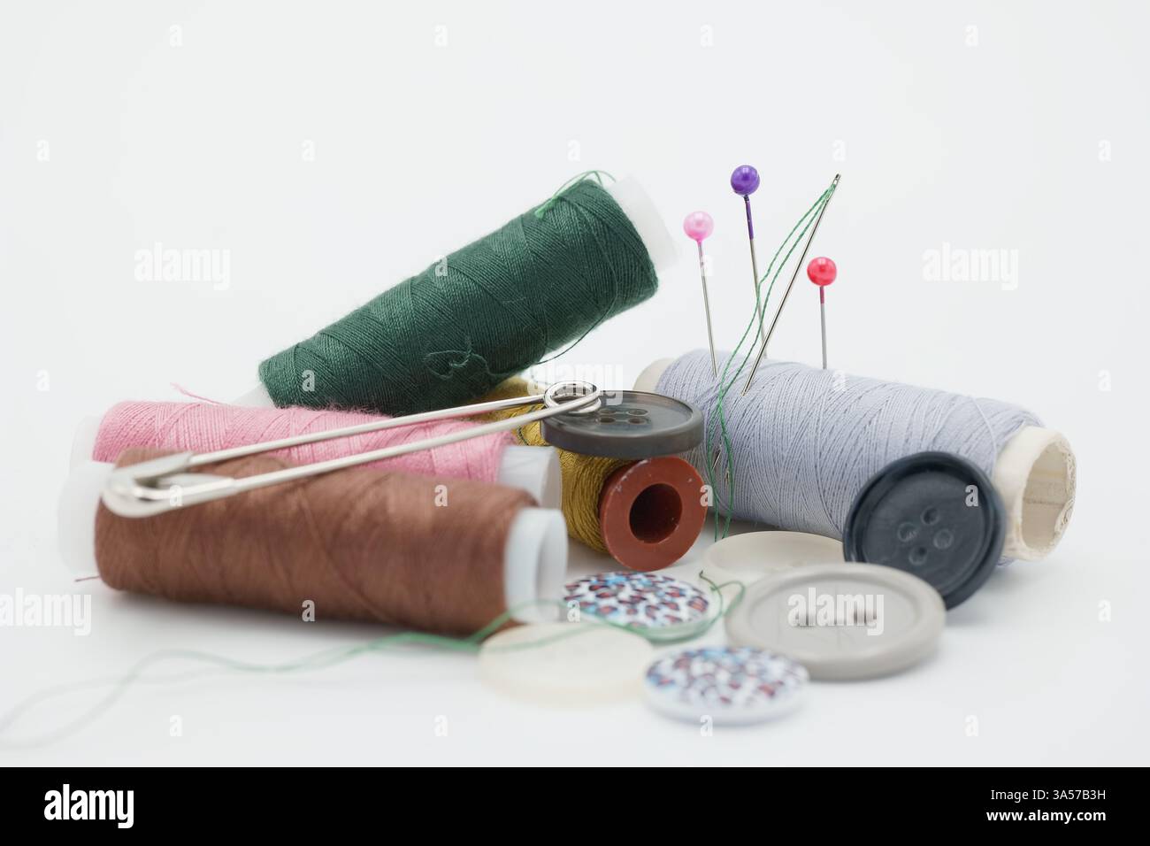 sewing threads and materials cut off on a white background Stock Photo ...