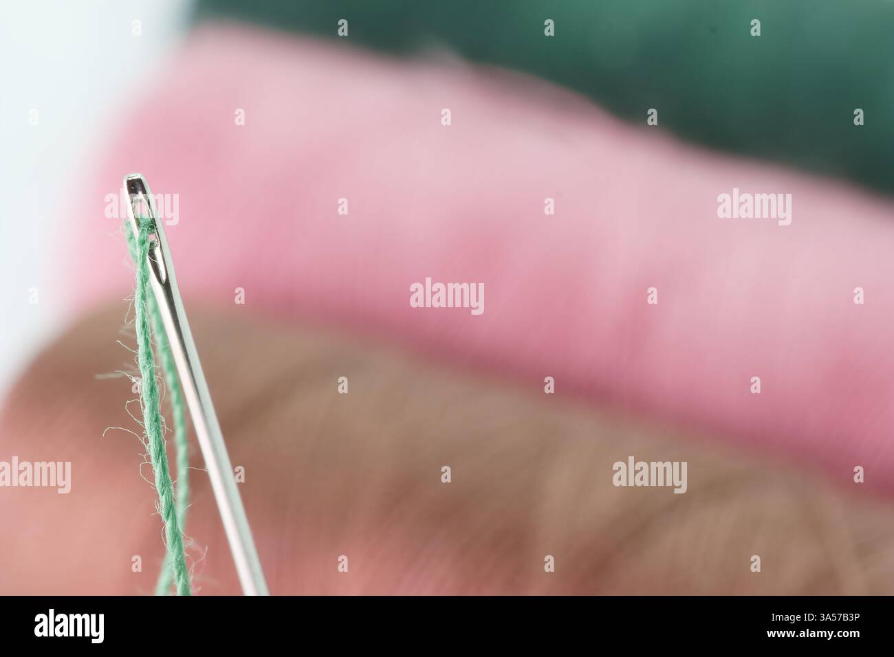sewing threads and materials cut off on a white background Stock Photo ...
