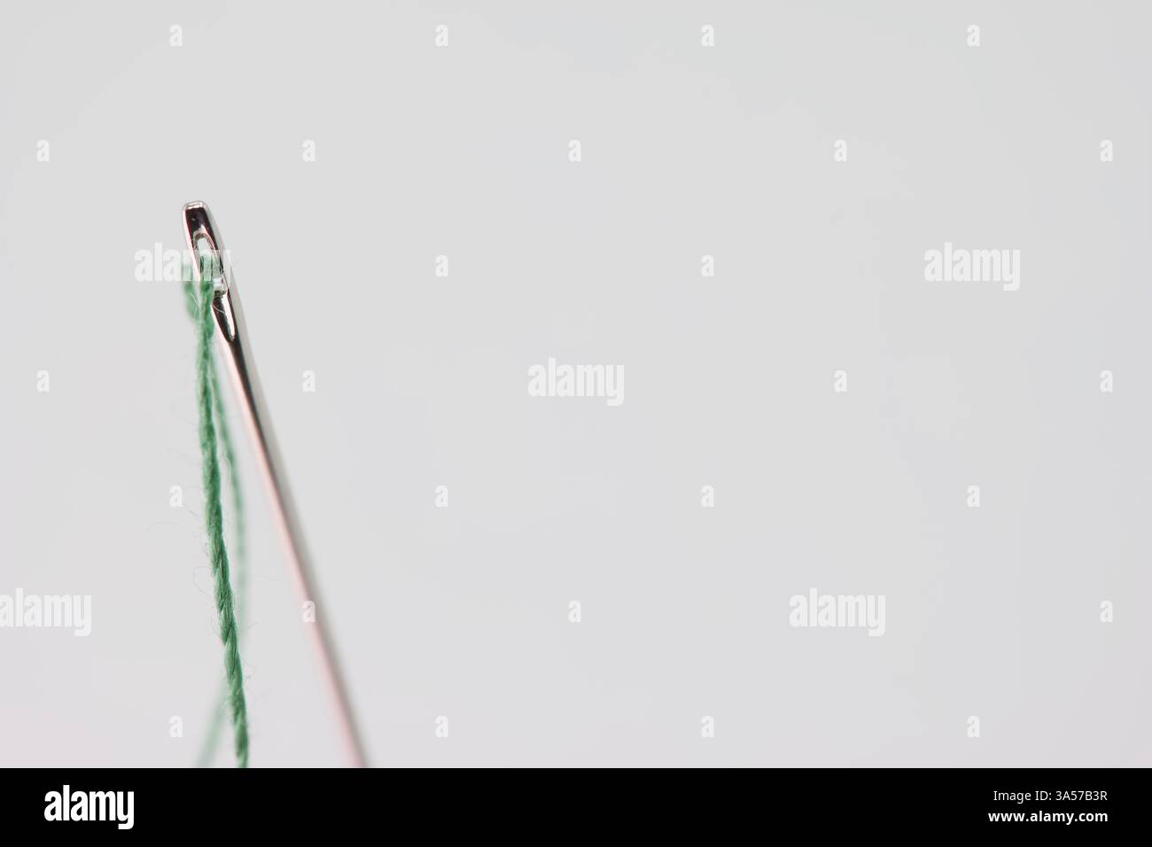 sewing threads and materials cut off on a white background Stock Photo ...