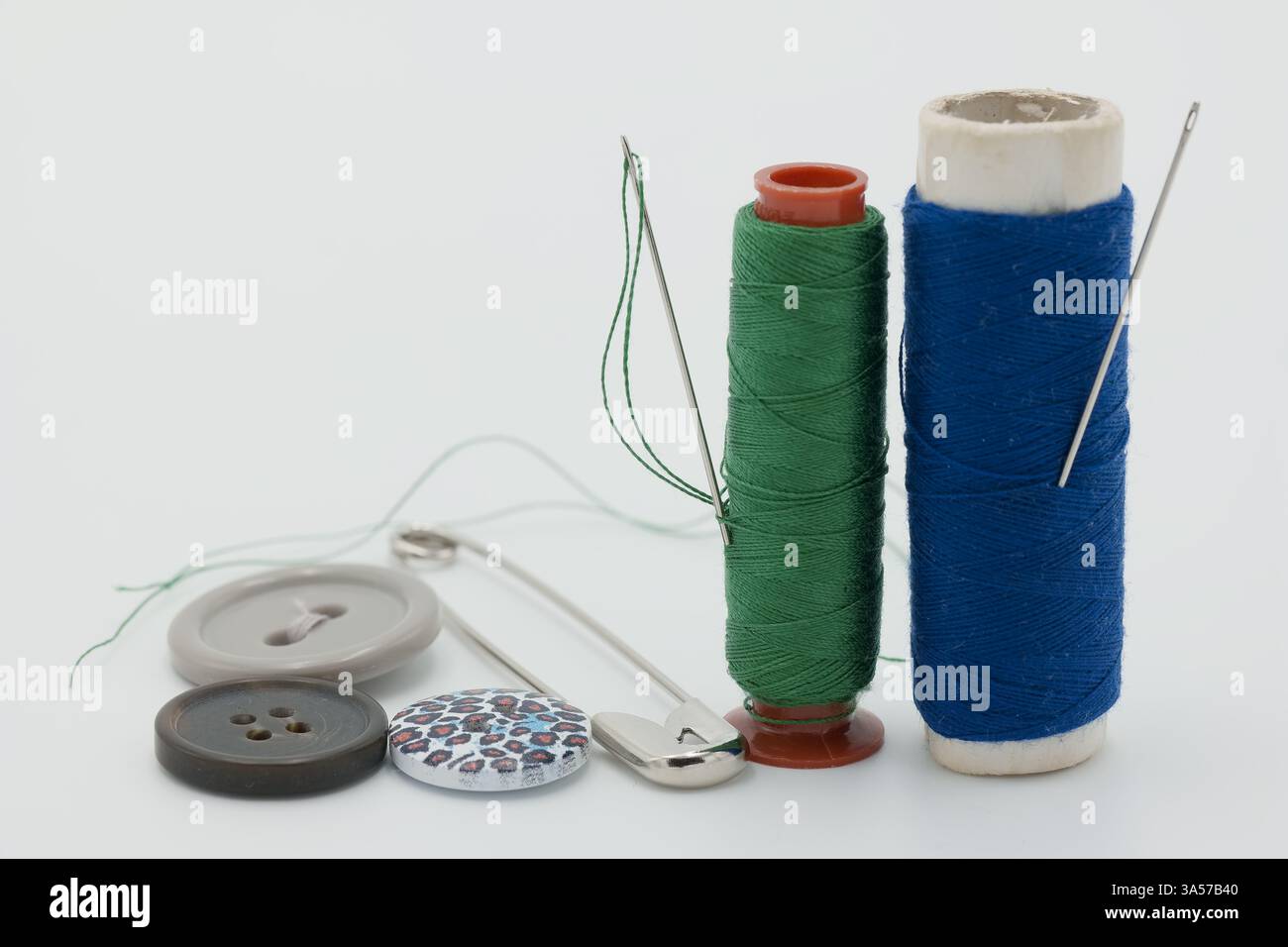 sewing threads and materials cut off on a white background Stock Photo ...