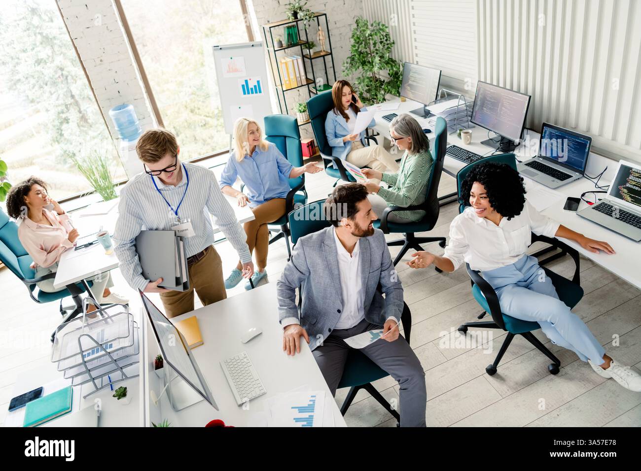 Modern office scene featuring diverse professionals collaborating and ...