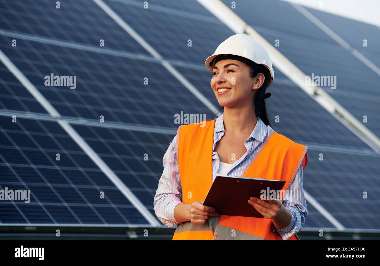 Female engineer holding energy panels hi-res stock photography and ...
