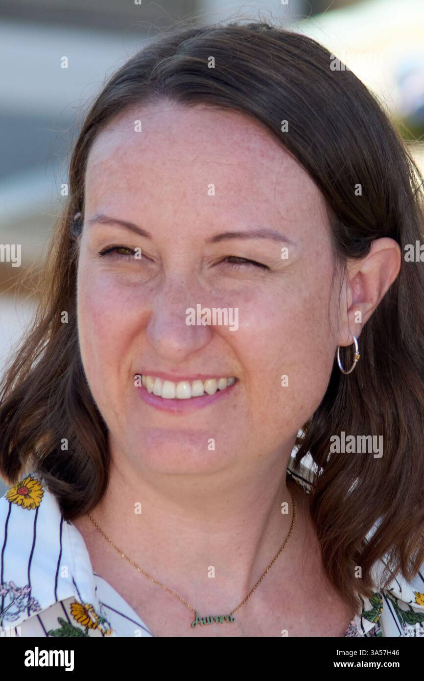 A woman s warm and inviting smile is captured in this image, ideal for ...