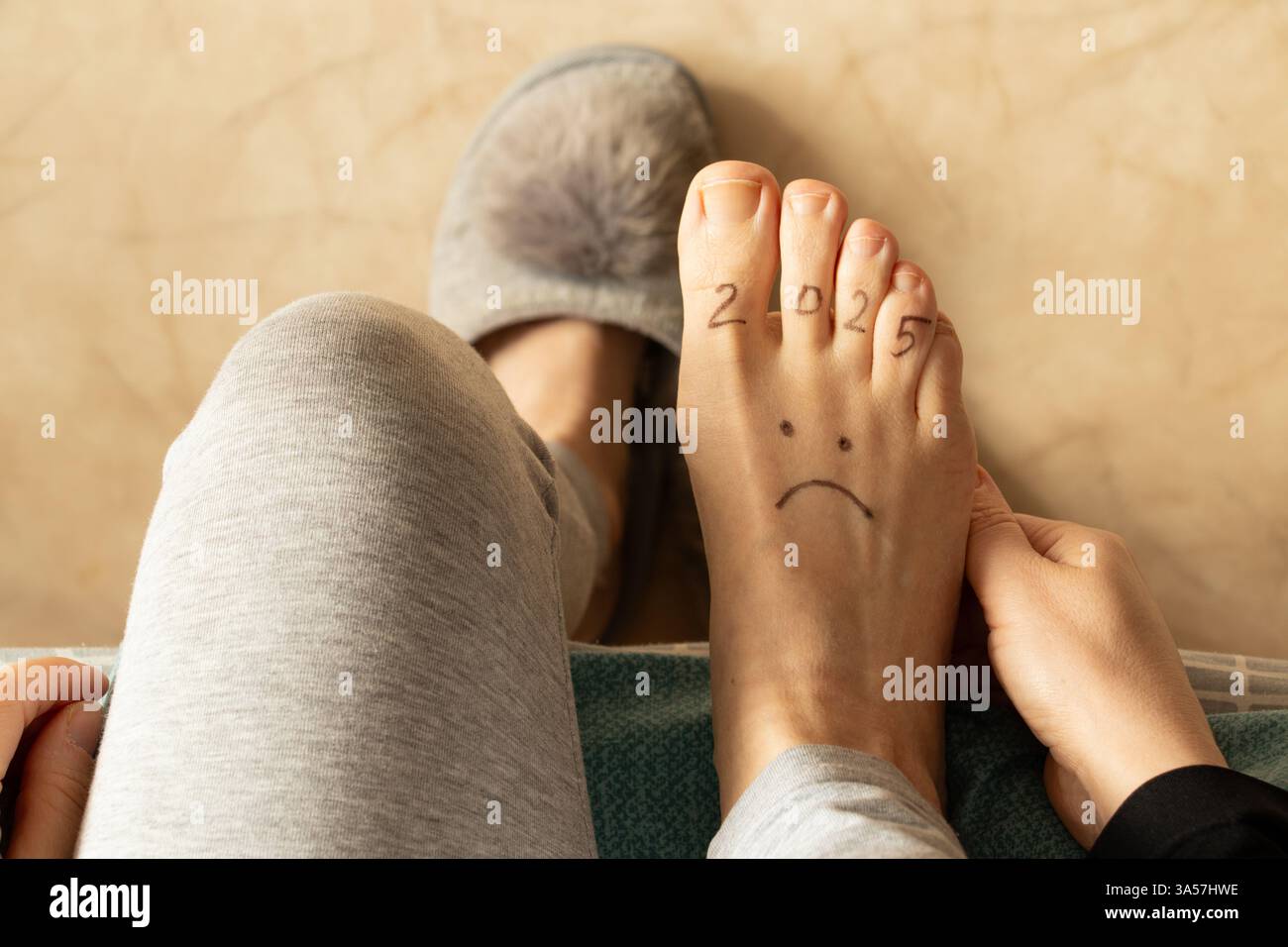 Drawing on the girl's leg 2025 and sad emotions at home on the floor ...