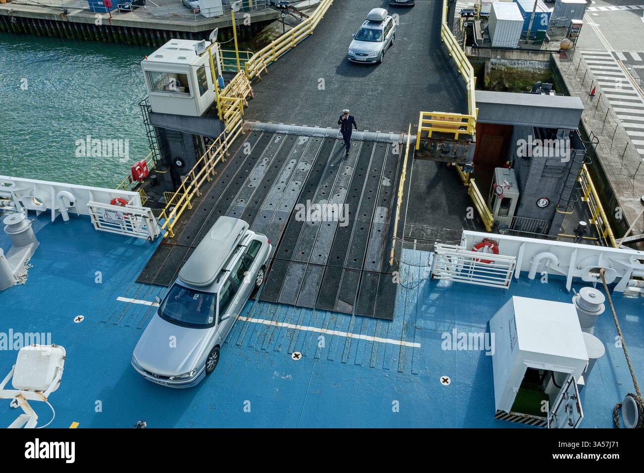 Vehicles drive onto a Brittany Ferries roll on roll off ferry at ...