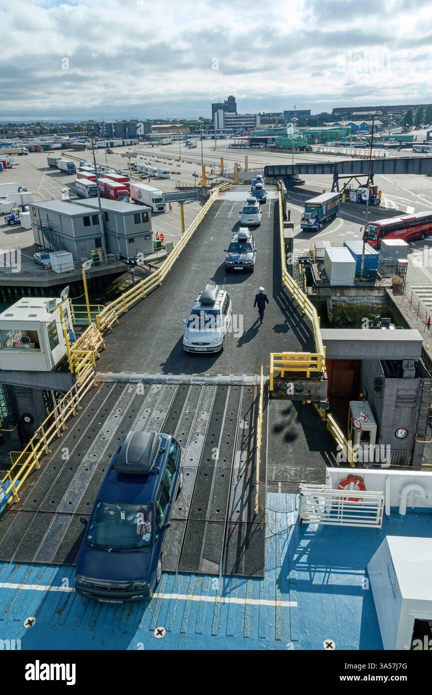 Vehicles drive onto a Brittany Ferries roll on roll off ferry at ...