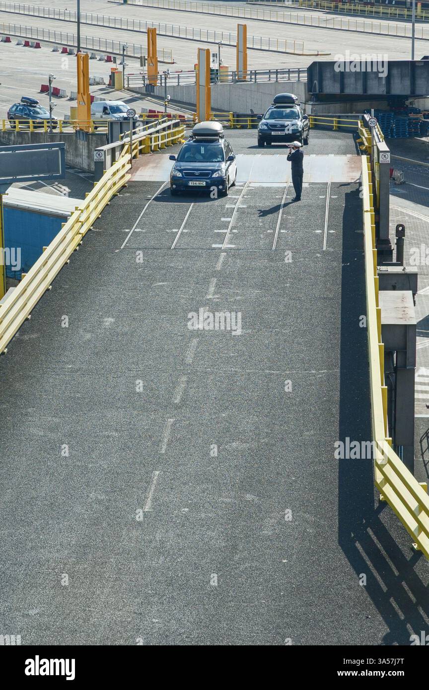 Vehicles drive onto a Brittany Ferries roll on roll off ferry at ...