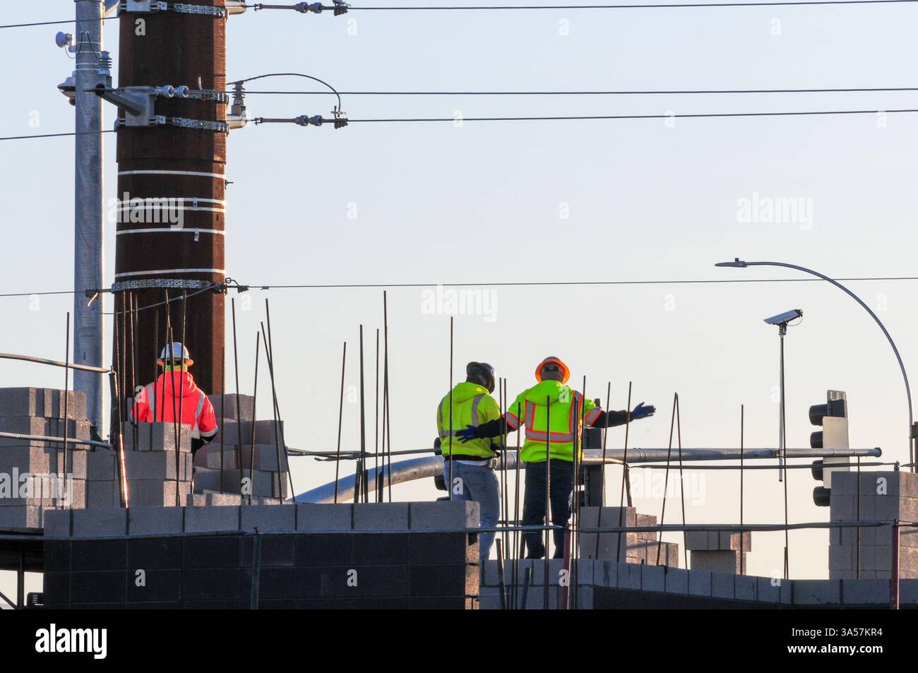 March 21, 2025, Mesa, Arizona, USA: Construction workers build ...