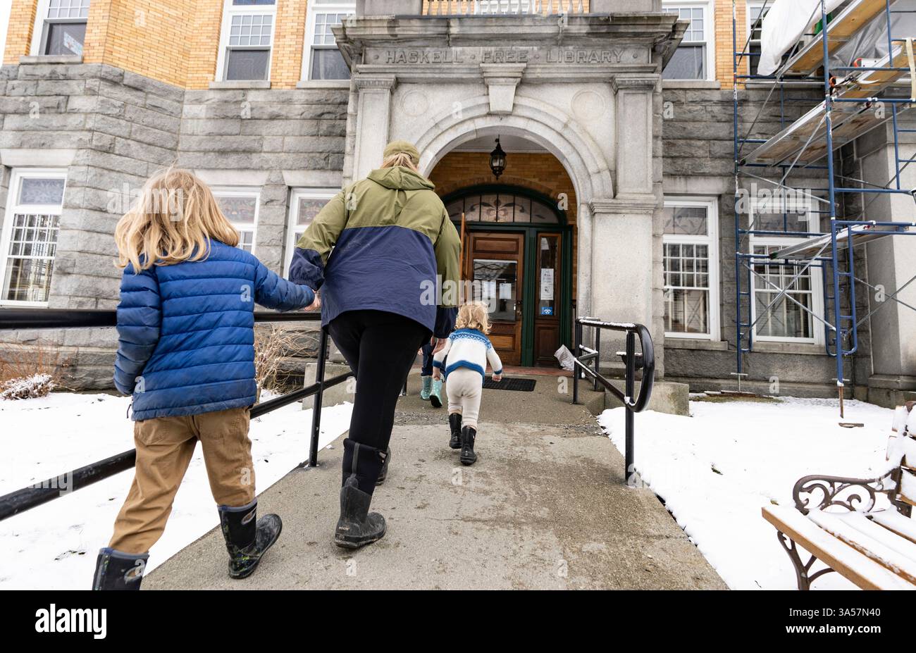 A family from the United States enters the Haskell Free Library and ...