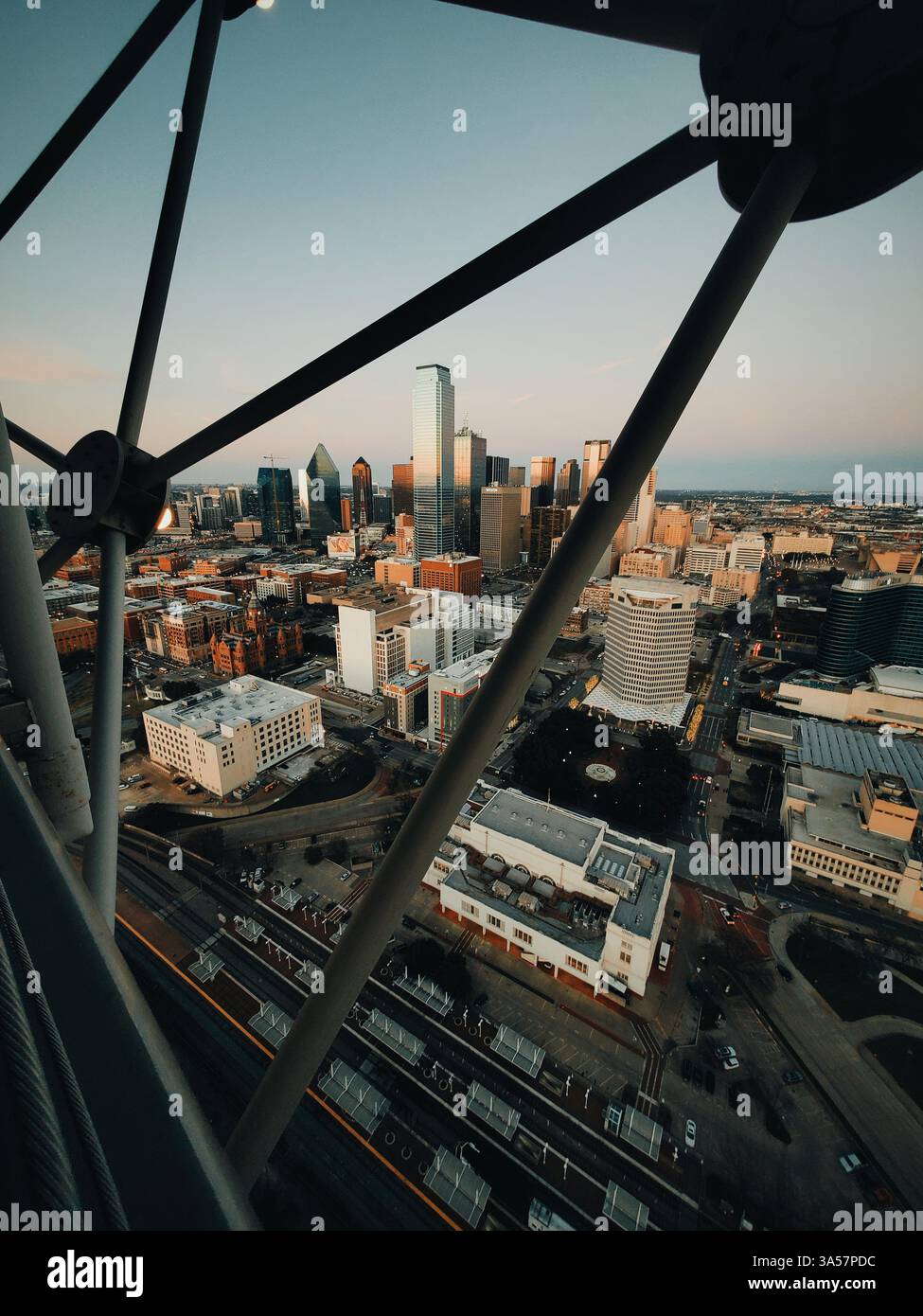 A breathtaking aerial view of Dallas skyline at dusk, framed by bridge ...